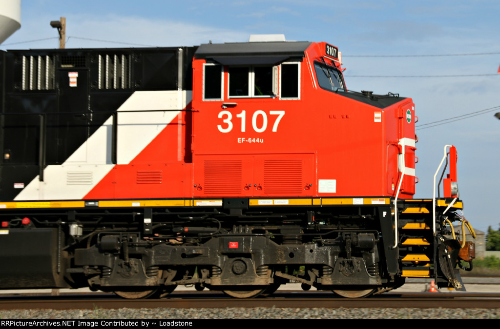 CN 3107 in action, not this Forth Worth crap behind trees and fences